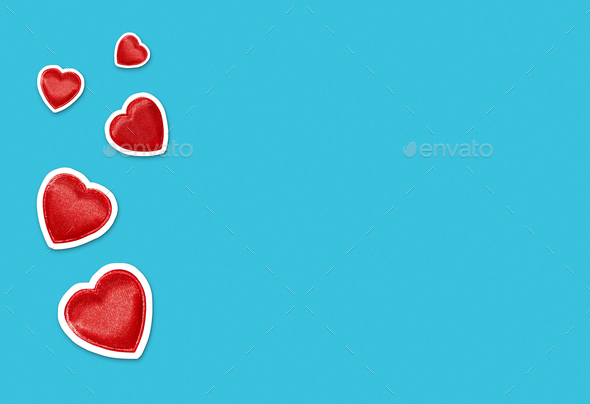 Valentines day background with red heart cut outs Stock Photo by Cebas